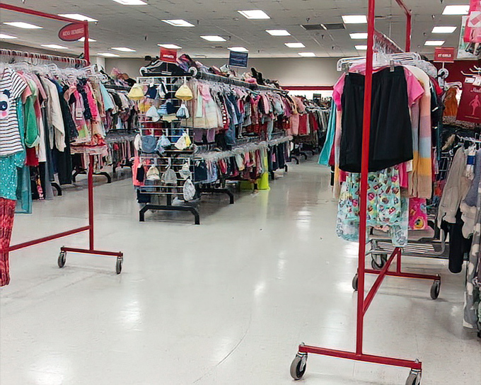 A rainbow explosion of children's clothing. Parents know the secret: kids outgrow everything in months, making this section pure financial genius.