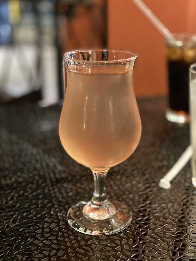 A delicate cider that balances sweetness and complexity, served in the proper glassware because details matter in this temple to taste.