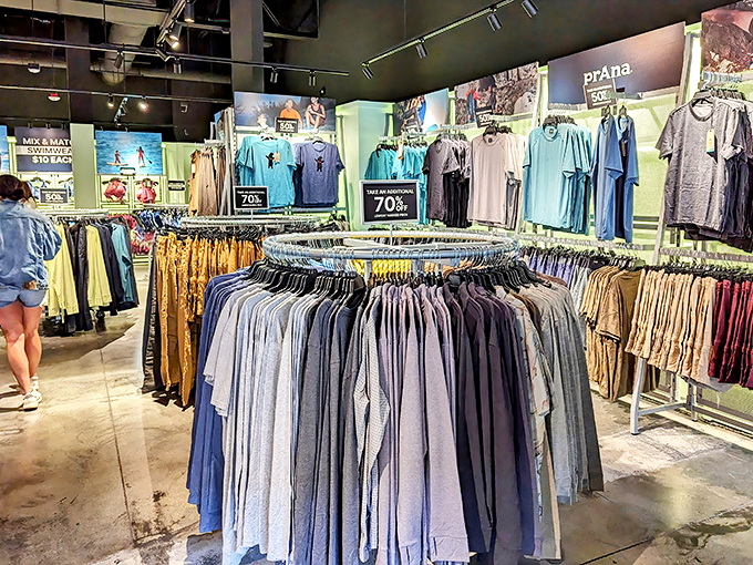 Racks of carefully organized shirts await their forever homes, each one a potential wardrobe hero at a fraction of department store prices.