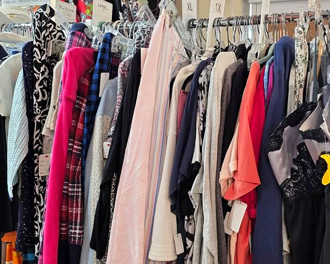 The clothing rainbow where fashion dreams come true. This technicolor display of garments proves one shopper's castoff is another's treasure.