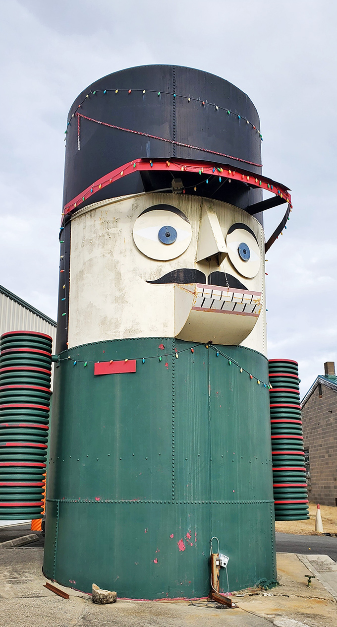 Festive lights adorn the nutcracker's hat during holiday seasons, adding extra sparkle to this already eye-catching roadside giant.