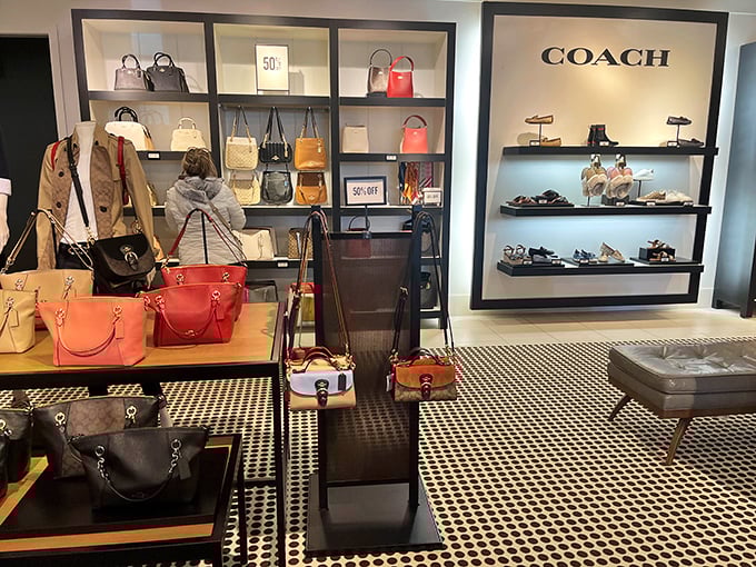The Coach store display&mdash;where handbags are arranged with such care, you'd think they were Renaissance paintings rather than leather accessories.