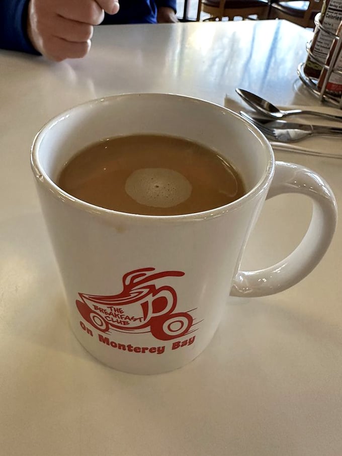 Coffee served in a mug substantial enough to hug back. The logo promises and the brew delivers&mdash;liquid motivation in ceramic form.