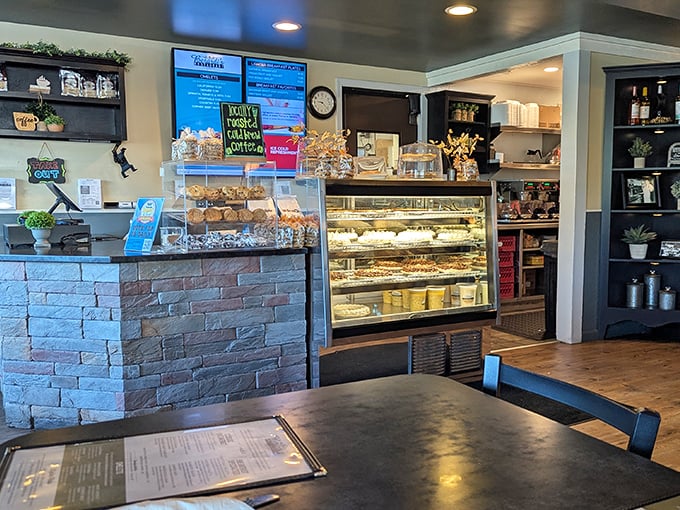The bakery counter tempts with homemade treats and fresh-brewed coffee, making it dangerously difficult to leave without something sweet for later.