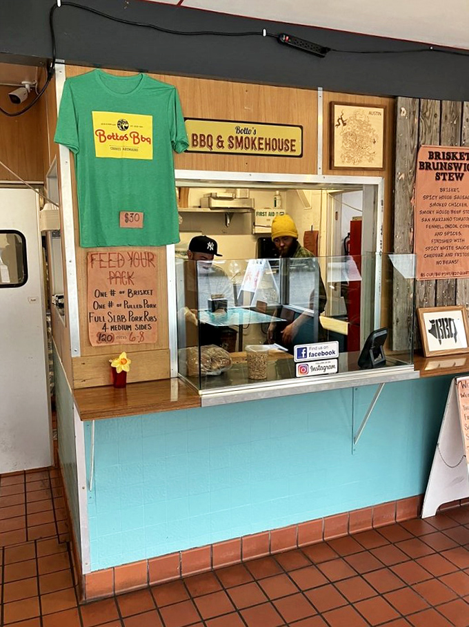 Behind this counter, barbecue artisans perform their smoky magic, with a green t-shirt on display that's less merchandise and more badge of honor. 