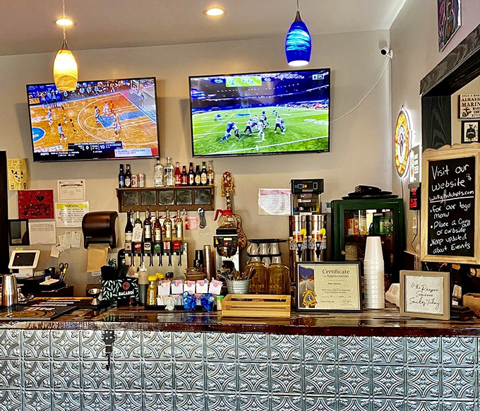 The bustling counter area with colorful pendant lights and TVs keeps the energy lively while you wait for your meal.