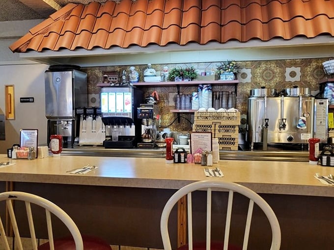 The counter at Zoto's offers front-row seats to the coffee station. Those silver dispensers hold liquid gold that keeps Bucks County running.