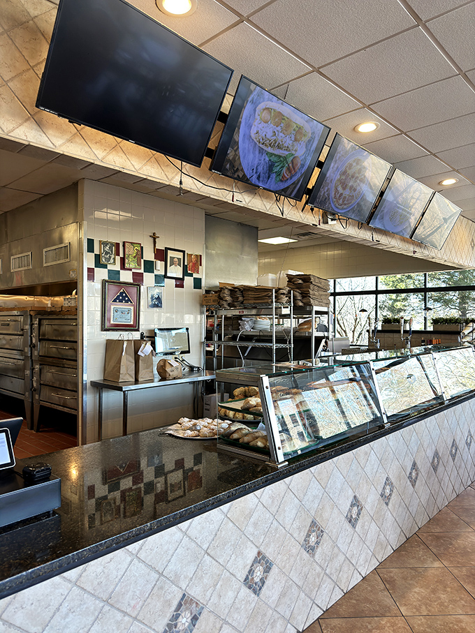 Behind the counter is where dreams are made. Those pizza-laden display cases are the adult equivalent of a toy store window.