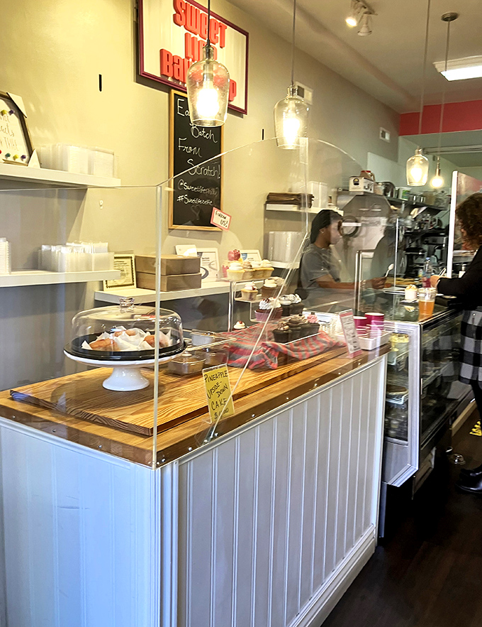 Behind this counter, dessert dreams come true. The protective glass is all that stands between you and immediate sugar-induced bliss.