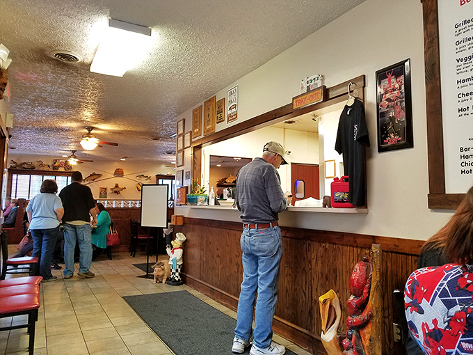 The ordering counter: where dreams of smoked meat become delicious, sauce-covered reality.