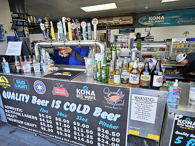 Behind the counter, the real action happens &ndash; where fresh seafood transforms into crispy, golden happiness.