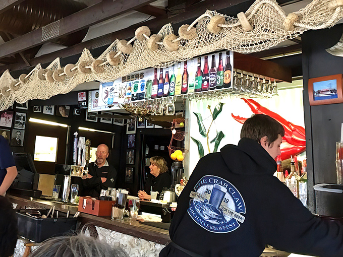 The bar at The Crab Claw isn't just where drinks are served&mdash;it's where local legends are born and seafood tall tales get taller.
