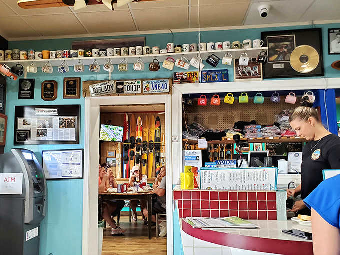 A collection of coffee mugs that would make any collector envious &ndash; hanging like trophies above a counter that's seen decades of breakfast dreams.