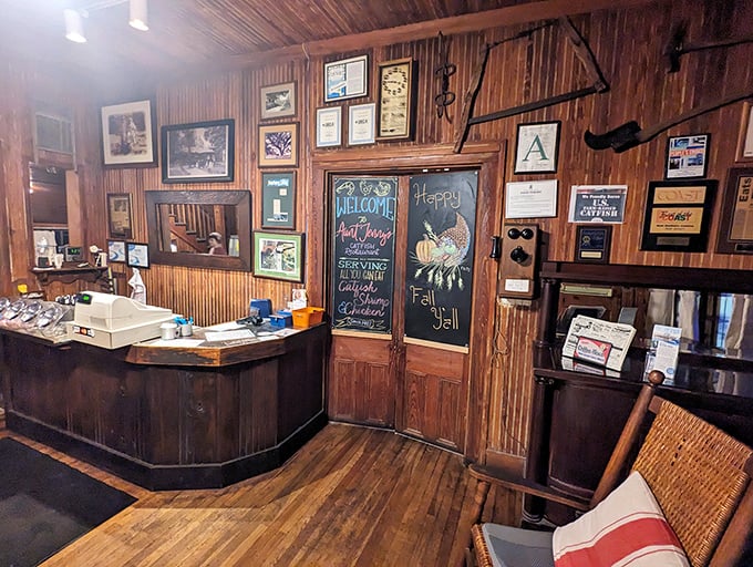 The host stand tells you everything: wooden walls, chalkboard specials, and decades of hospitality baked into every surface.