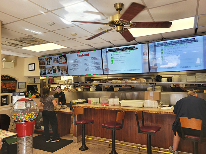 The counter area offers a glimpse into the organized chaos where culinary magic happens—complete with a gumball machine for dessert appetizers.