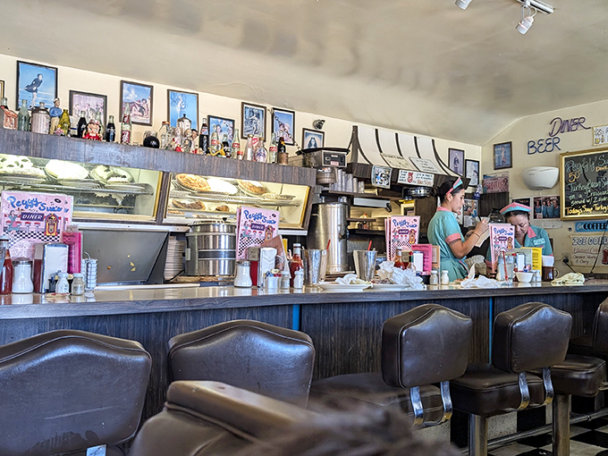 The counter where magic happens. Those stools have heard more stories than a bartender, and the coffee keeps flowing like conversation.