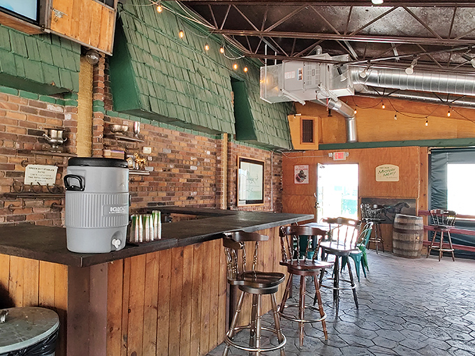 Rustic charm with a side of anticipation. The simple wooden counter seating offers front-row views to the slider-making magic.