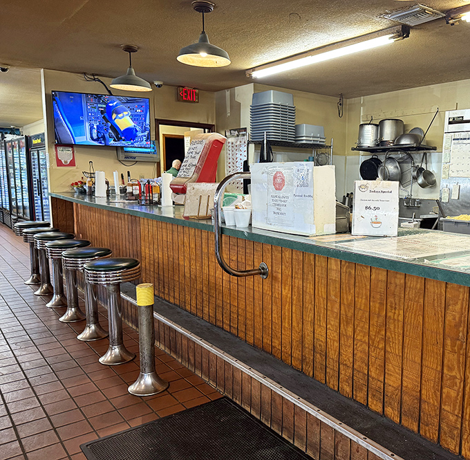 Counter seating: where the magic happens. Those classic diner stools have supported generations of hungry folks waiting for their barbecue fix.