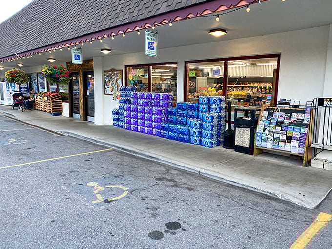 Grocery shopping becomes a cultural experience when water bottles stack up like edible art outside a Bavarian-themed market.
