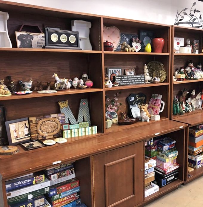 Board games and decorative treasures share shelf space like old friends, each promising different kinds of rainy-day entertainment.