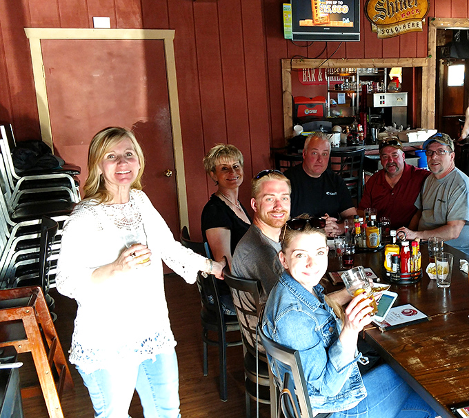 Where locals gather to share stories, watch the game, and debate the merits of various condiments with passionate intensity.