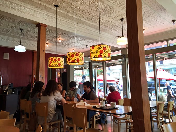 The true measure of a great bakery: locals gathering to break bread together under those distinctive colorful lampshades.