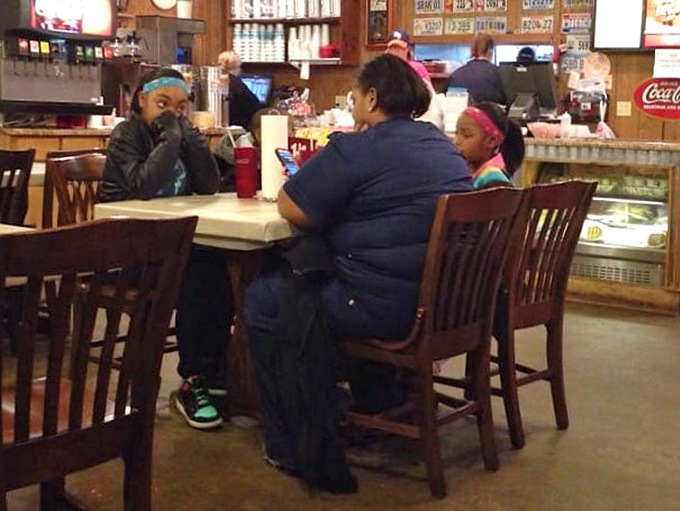 The restaurant brings families together around tables where conversations pause only for the important business of savoring each bite.