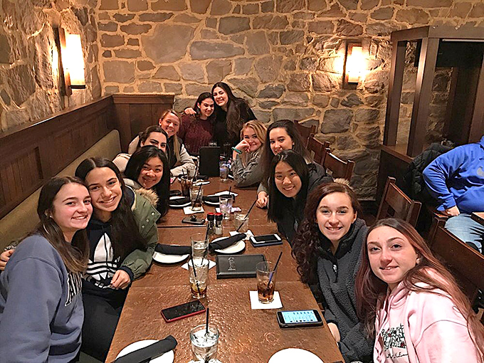 The stone walls and wooden accents create the perfect backdrop for memory-making. These diners aren't just eating—they're experiencing medieval hospitality.