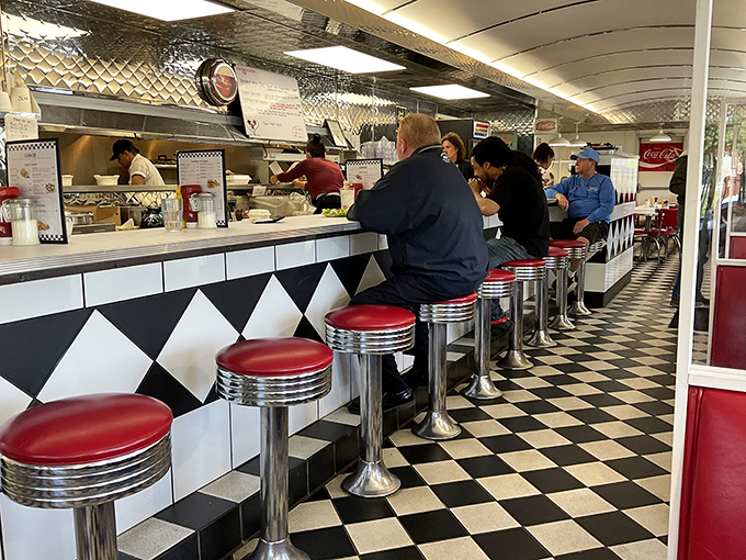 The counter experience&mdash;where regulars and newcomers sit shoulder to shoulder, united by the universal language of "pass the ketchup, please."
