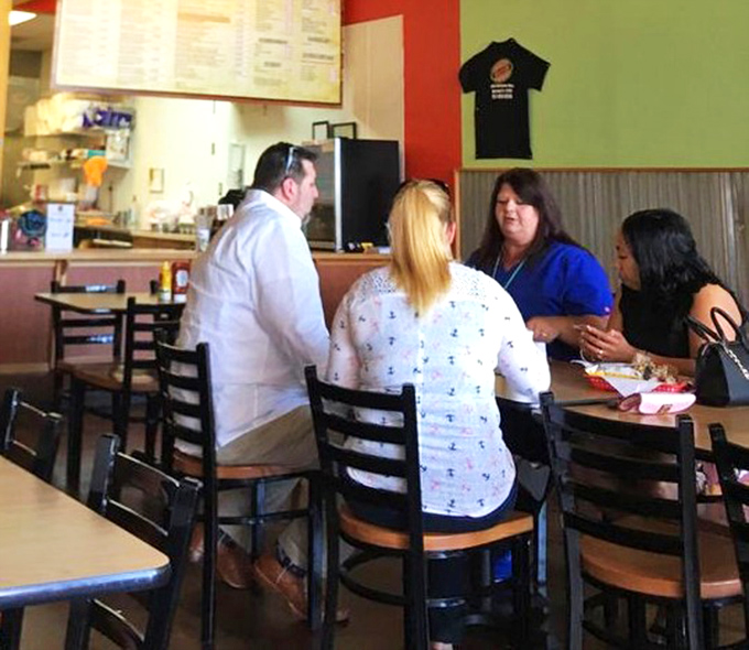 The dining room buzzes with that special energy that only comes from people discovering something truly delicious together.