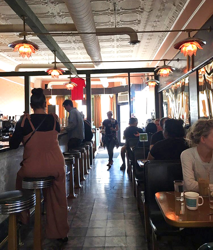 The bustling interior captures that perfect Chicago energy: strangers united by the universal language of "this food is worth the wait."