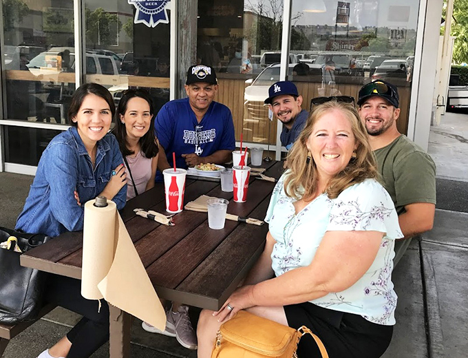 Happy diners gathered around the table&mdash;the universal sign that you've found a place worth bringing the whole crew.