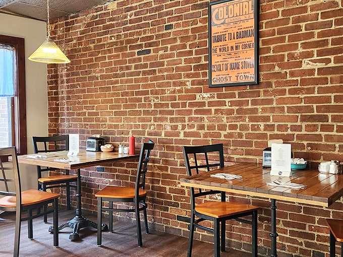 Exposed brick walls and simple wooden tables create that perfect "neighborhood spot" vibe where conversations flow as easily as the coffee.