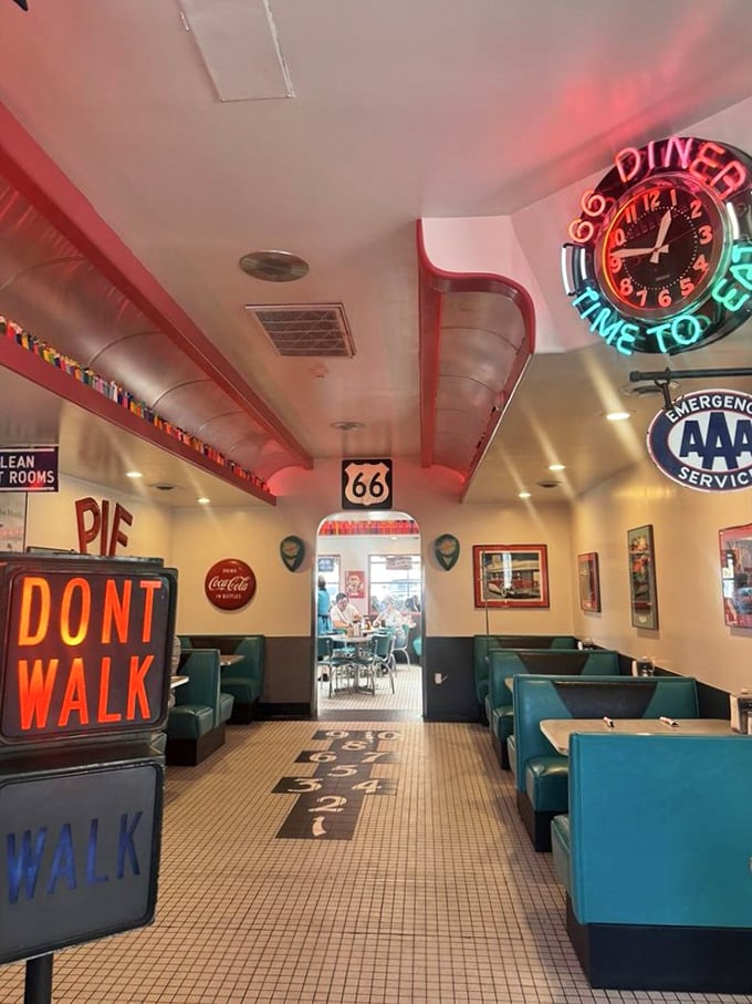 The dining area feels like a movie set where the Fonz might appear any minute, neon signs casting their rosy glow over hungry patrons.