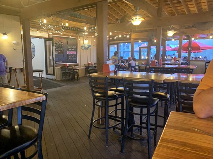 The dining area's string lights and wooden details create the perfect backdrop for the "I can't believe I ate the whole thing" conversation.