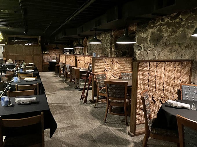 Cork-lined dividers and intimate tables create dining nooks where conversations flow as freely as the wine.