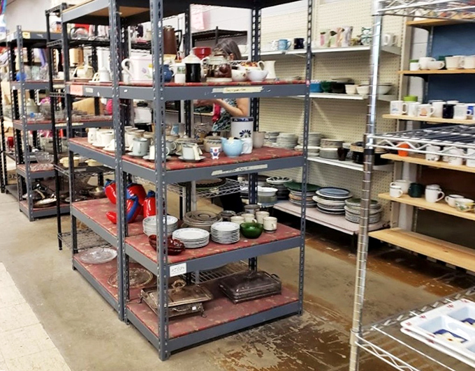 Industrial shelving packed with plates and bowls&mdash;kitchen essentials with history baked right in.