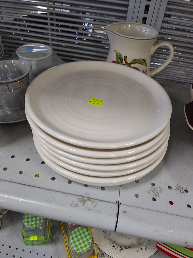 Simple white plates stacked like pancakes, waiting to host countless future family dinners without breaking anyone's budget whatsoever.