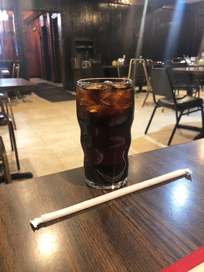 In the temple of meat, even the soda feels special—served in a glass that's seen more Jersey history than most history books.