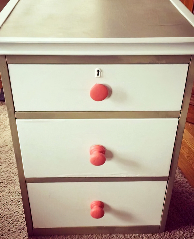 Mid-century charm meets modern bargain. This dresser with its cheerful coral knobs is just begging to organize your sock drawer with vintage flair.