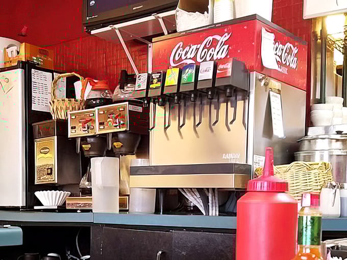 The classic soda fountain setup with ketchup bottles standing guard—some things work perfectly without needing modern upgrades.