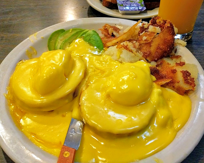 Eggs Benedict with hollandaise so yellow it could outshine the California sun, accompanied by potatoes that clearly took their crisping duties seriously.