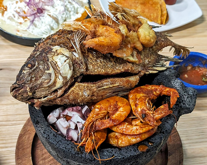 The molcajete isn't just a dish&mdash;it's a volcanic rock concert of seafood starring a whole fish, shrimp, and octopus in a spicy supporting role.