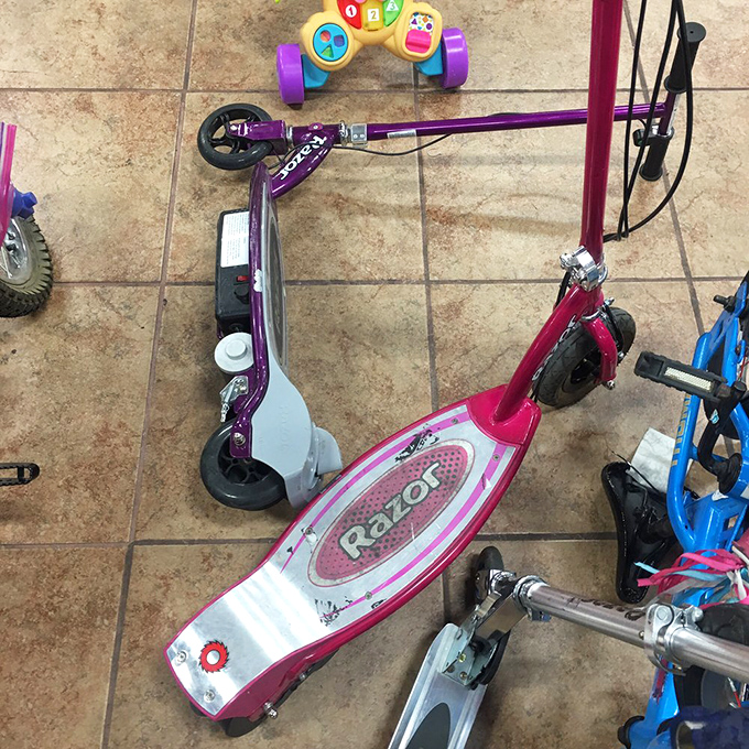 Razor scooters that once zoomed down suburban sidewalks now await their next adventure. Childhood nostalgia at bargain prices!