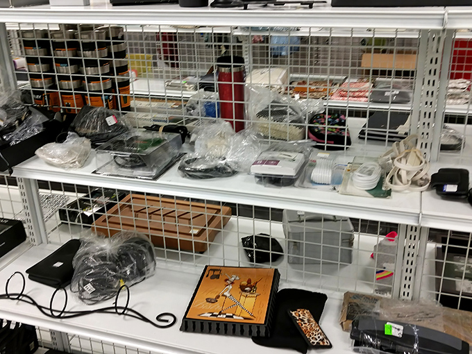 Electronic gadgets and vintage knick-knacks share shelf space in perfect harmony, like a physical manifestation of your parents' junk drawer&mdash;but organized.