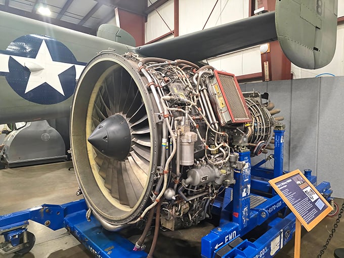 The exposed jet engine reveals the mechanical heart of aviation. Like seeing inside a watch, but with enough power to launch you across continents.