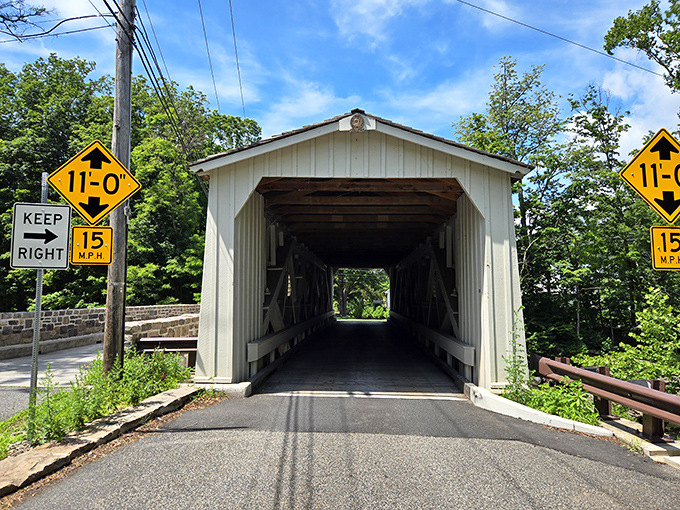 Warning signs frame the entrance like sentinels &ndash; 11 feet clearance and a gentle reminder to keep right.