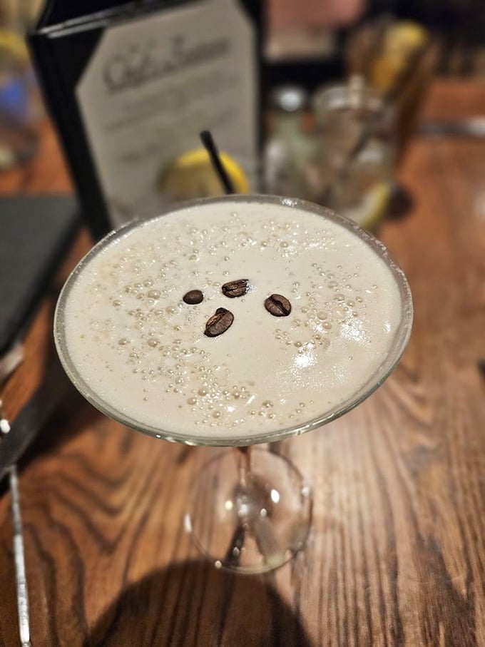 An espresso martini garnished with coffee beans&mdash;because sometimes you need to be simultaneously buzzed and wide awake.