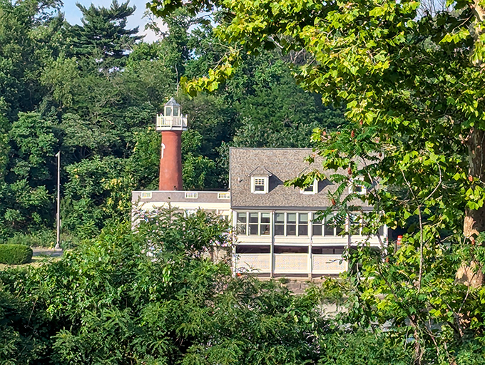 Nestled among lush greenery, the lighthouse plays hide-and-seek with visitors approaching from certain angles. Nature's perfect frame.
