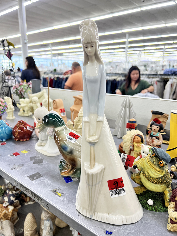 Porcelain figurines stand in elegant formation&mdash;yesterday's mantelpiece treasures hoping for adoption at prices that would make collectors weep with joy.